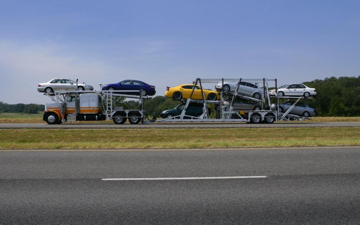 Side View of Hauling Truck Carriying Several Cars - JMN Logistics ...
